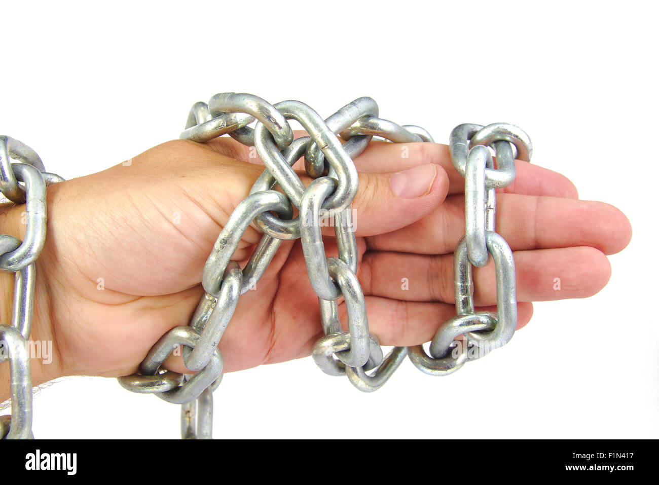 Chained hand of an adult man with a strong chain isolated on white ...