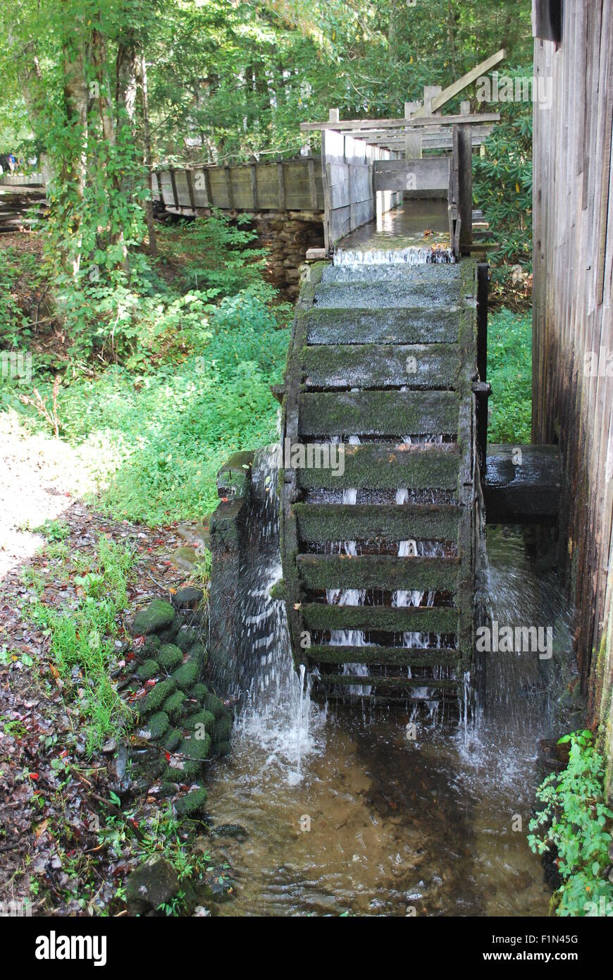 A vintage stone mill surrounded by a nature landscape Stock Photo - Alamy