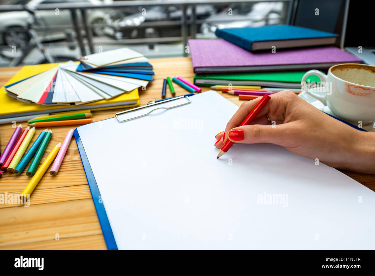 Writing with color pencil on the white sheet of paper Stock Photo - Alamy