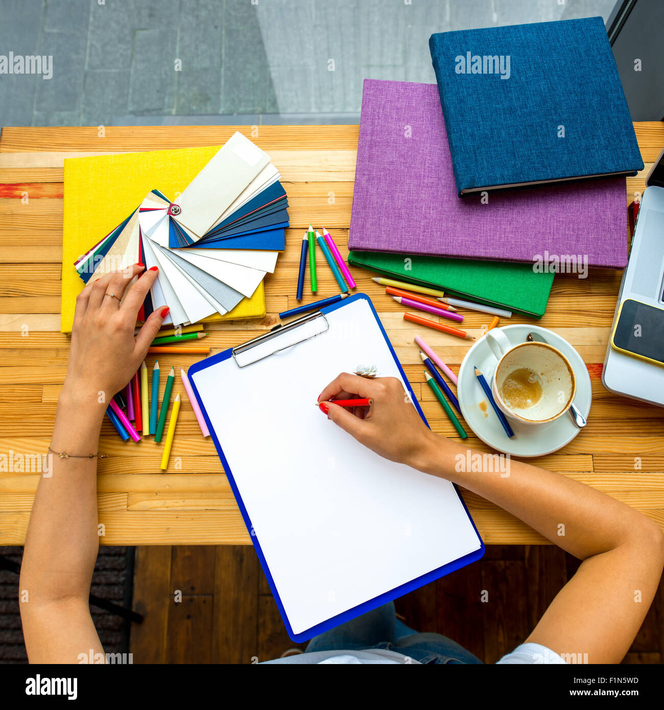 Writing with color pencil on the white sheet of paper Stock Photo - Alamy