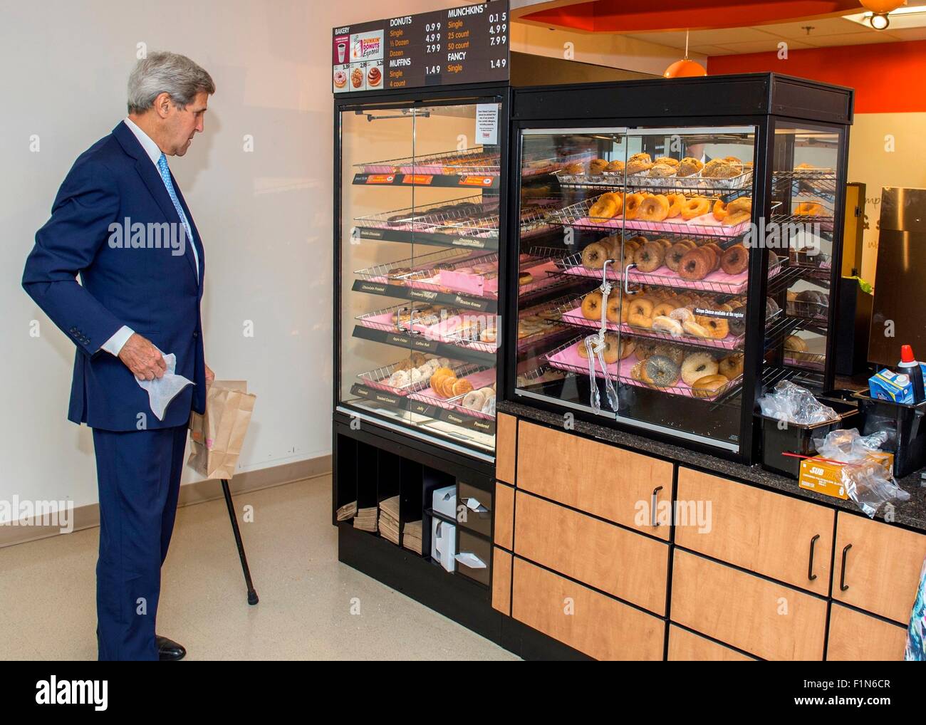 US Secretary of State John Kerry views a doughnut display at the newly ...