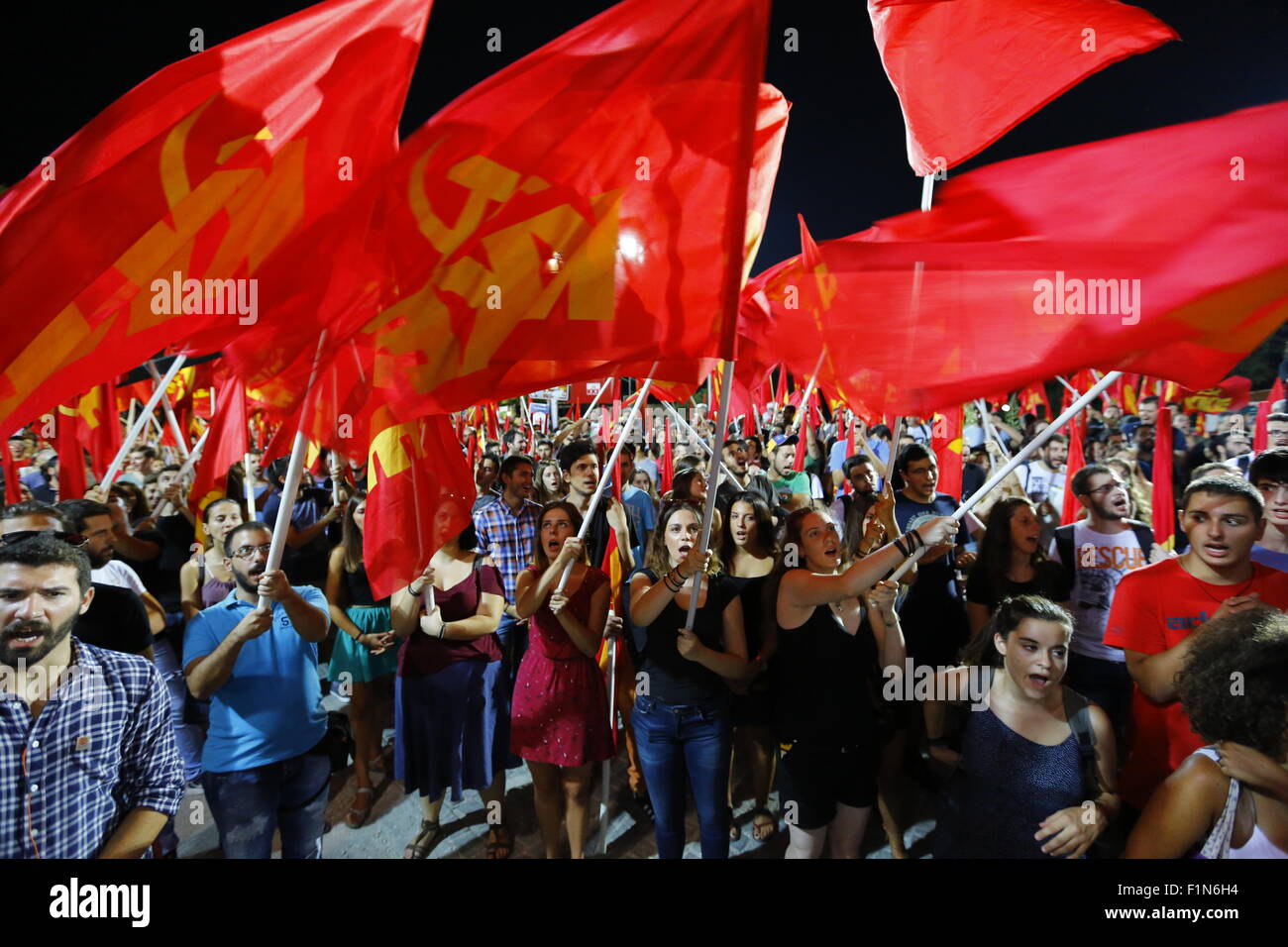 Athens, Greece. 4th September 2015. Young KNE supporters wave KKE flags ...