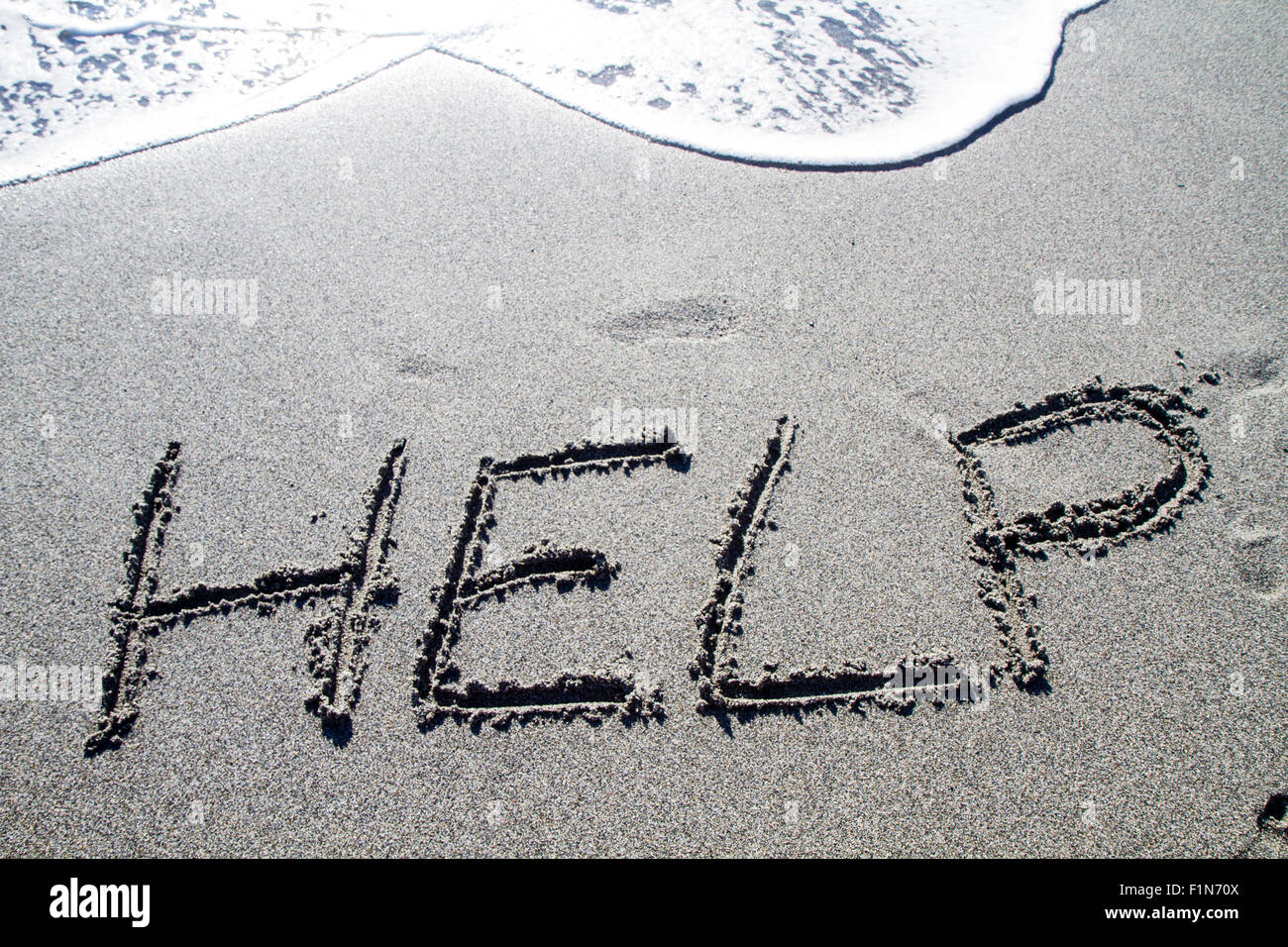 words written on the pebble beach, natural background Stock Photo - Alamy