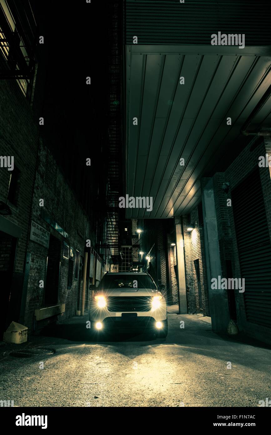 Dark Alley Drive. American City at Night. SUV on the Alley Stock Photo ...
