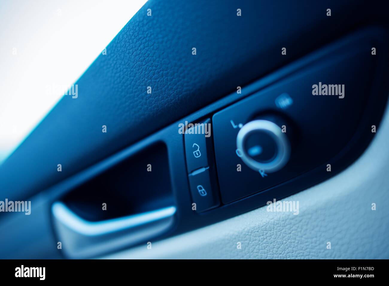 Modern Car Door Lock Buttons Closeup Stock Photo - Alamy