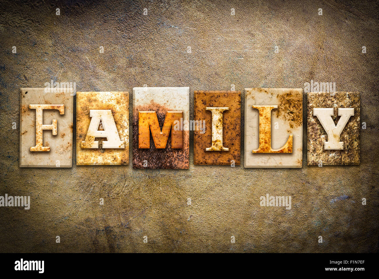The word "FAMILY" written in rusty metal letterpress type on an old ...