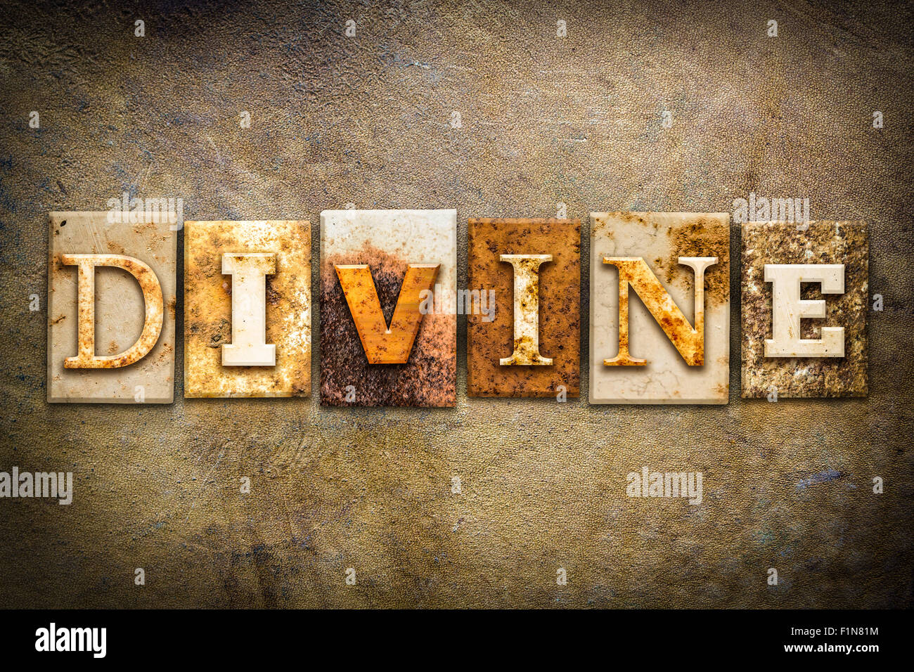 The word "DIVINE" written in rusty metal letterpress type on an old ...