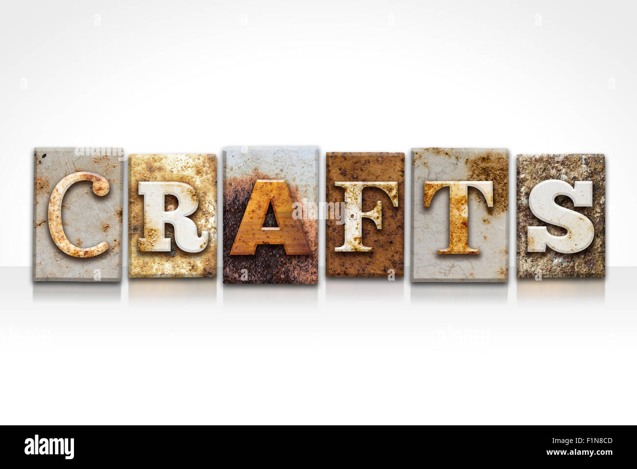 The word "CRAFTS" written in rusty metal letterpress type isolated on a ...