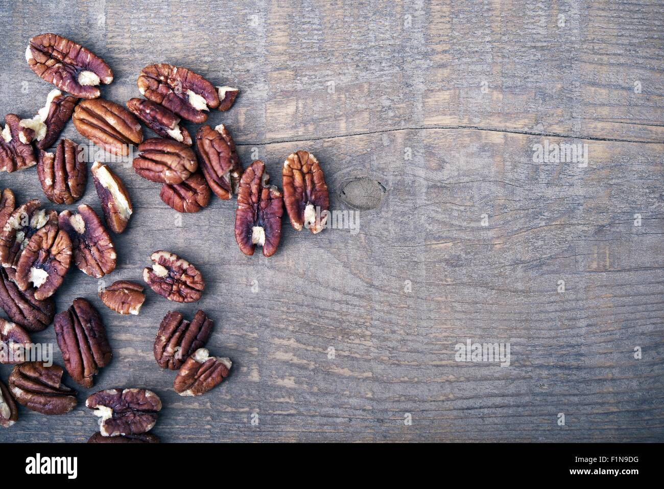 Raw Fresh Pecan Nuts on Aged Wood. Top View Stock Photo - Alamy