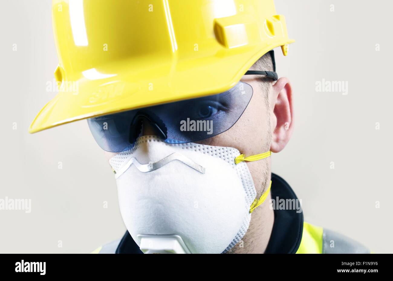 Contractor Face Closeup. Contractor in Safety Glasses, Yellow Helmet ...