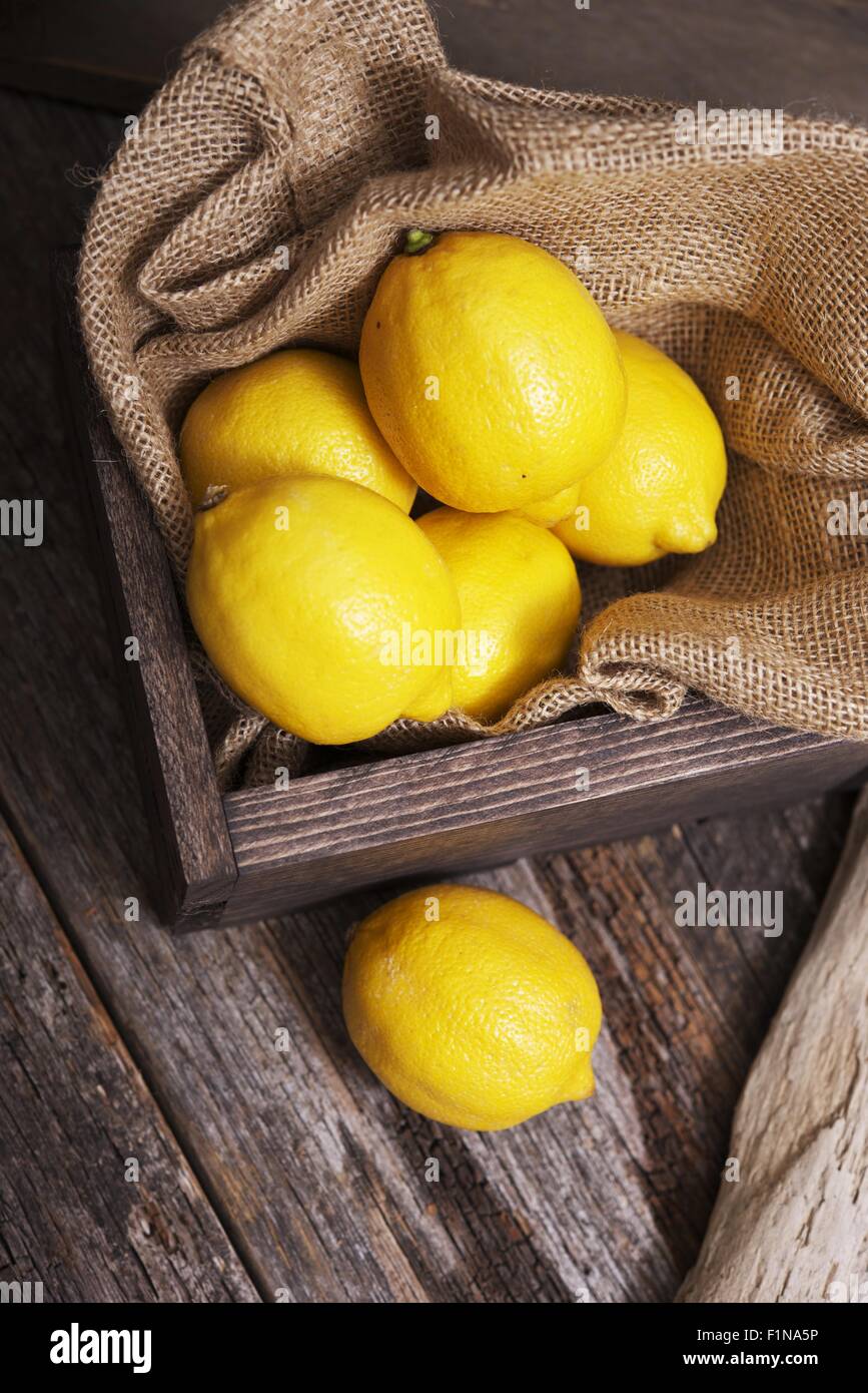 Fresh Raw Lemons Inside Wooden Crate on Aged Wood Table. Lemon Fruits ...