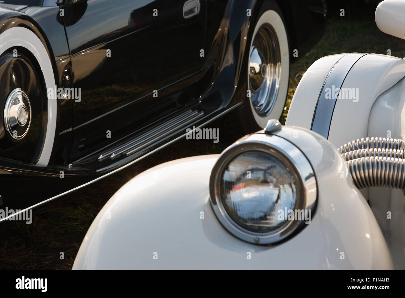 Close-up of black and white retro-styled cars Stock Photo - Alamy