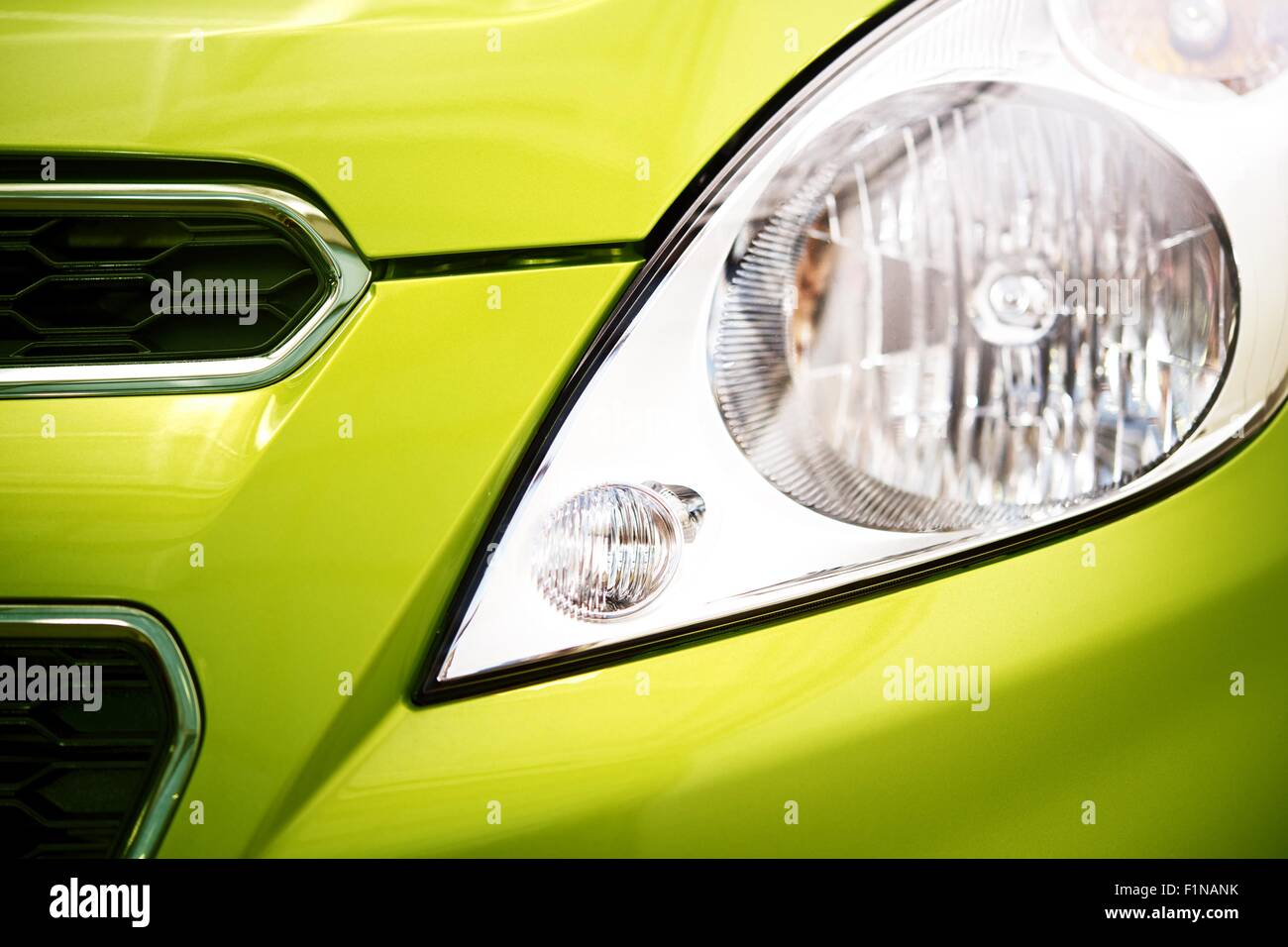 Modern City Car Closeup. Green Body Car Head Light Detailed Photo ...