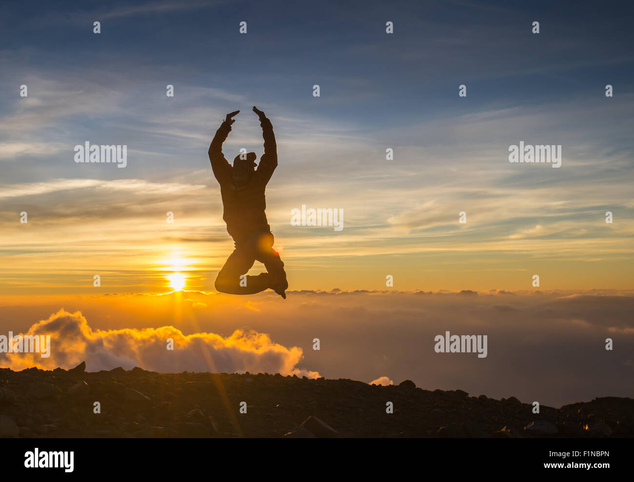 Man jump through the gap on sunset fiery background. Element of design ...
