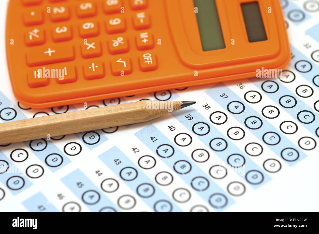 answer sheet test score with pencil and orange calculator Stock Photo ...
