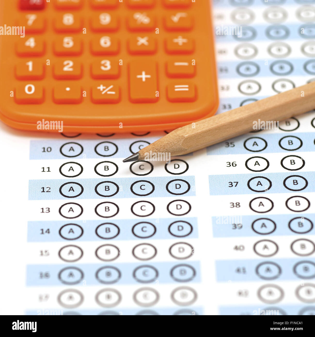 answer sheet test score with pencil and orange calculator Stock Photo ...