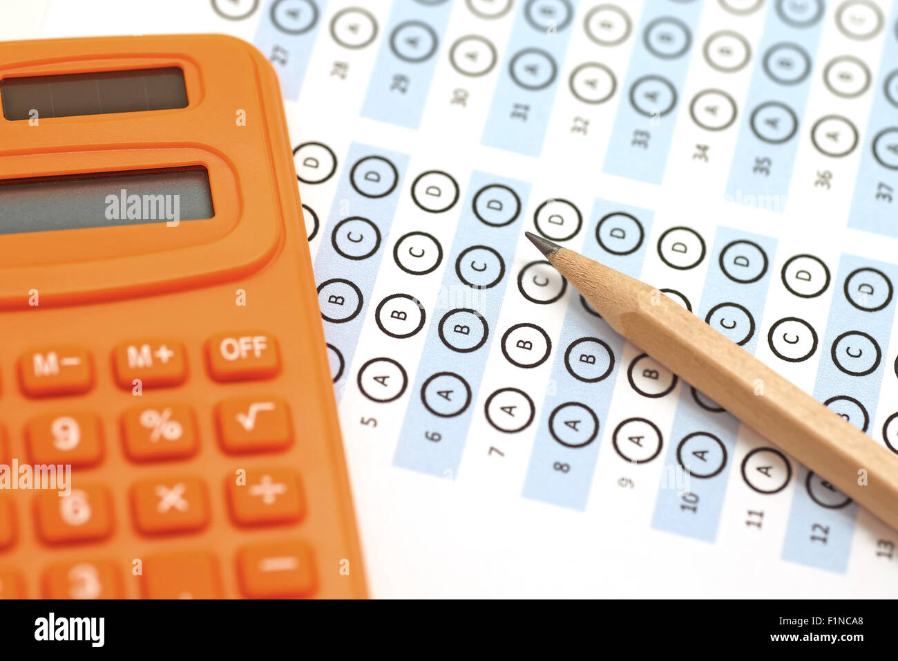 answer sheet test score with pencil and orange calculator Stock Photo ...