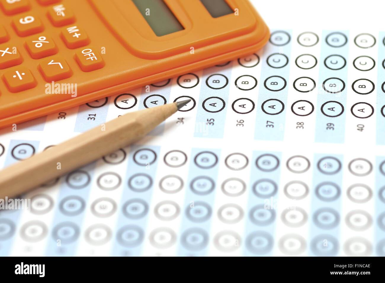 answer sheet test score with pencil and orange calculator Stock Photo ...