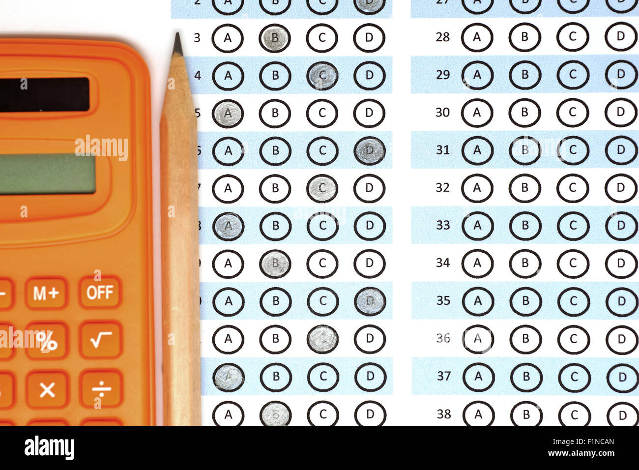 answer sheet test score with pencil and orange calculator Stock Photo ...