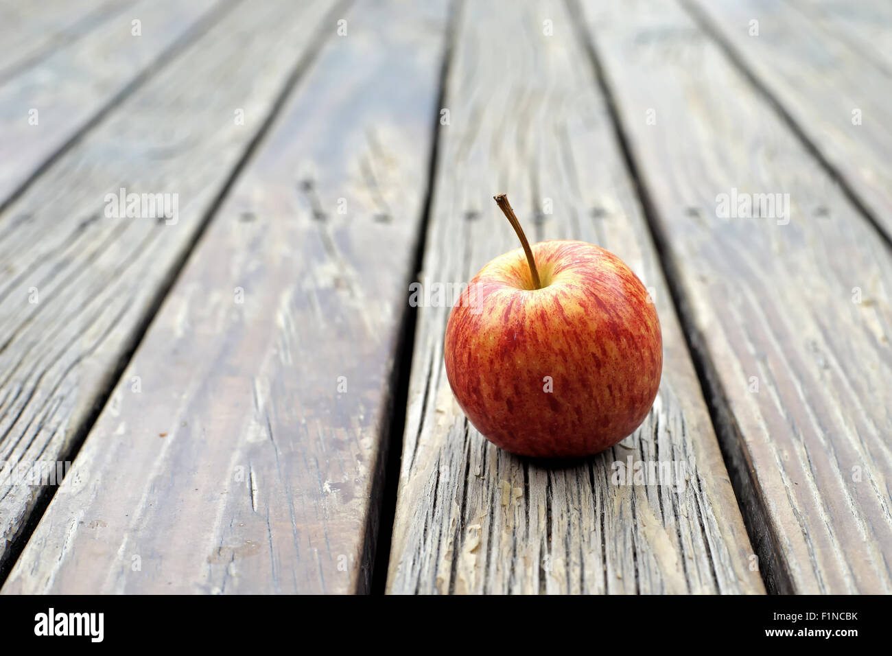 sweet apple fruit on wooden floor background Stock Photo - Alamy