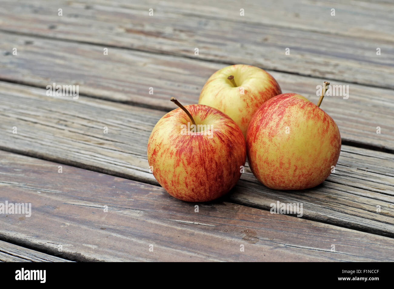 sweet apple fruit on wooden floor background Stock Photo - Alamy