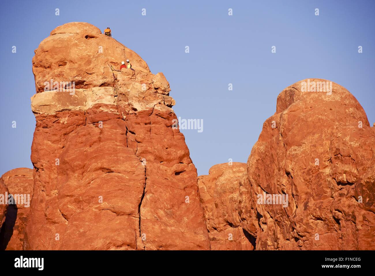 Climbing in Utah. Three Climbers on the Red Rock near Moab, Utah ...