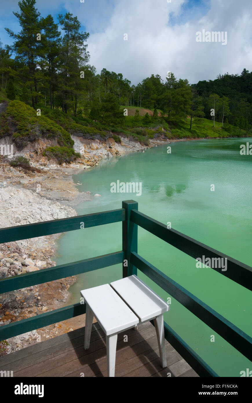 White bench at the corner of a cafe on the side of Lake Linow, a ...