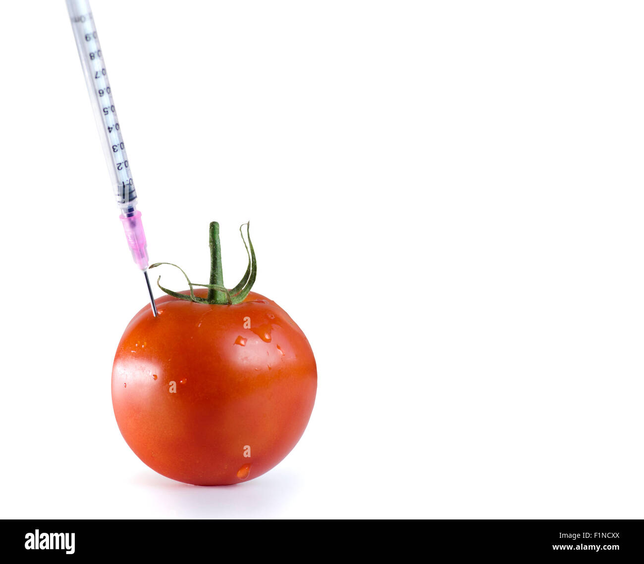 Genetically modified Organism food concept image. Needle syringe ...
