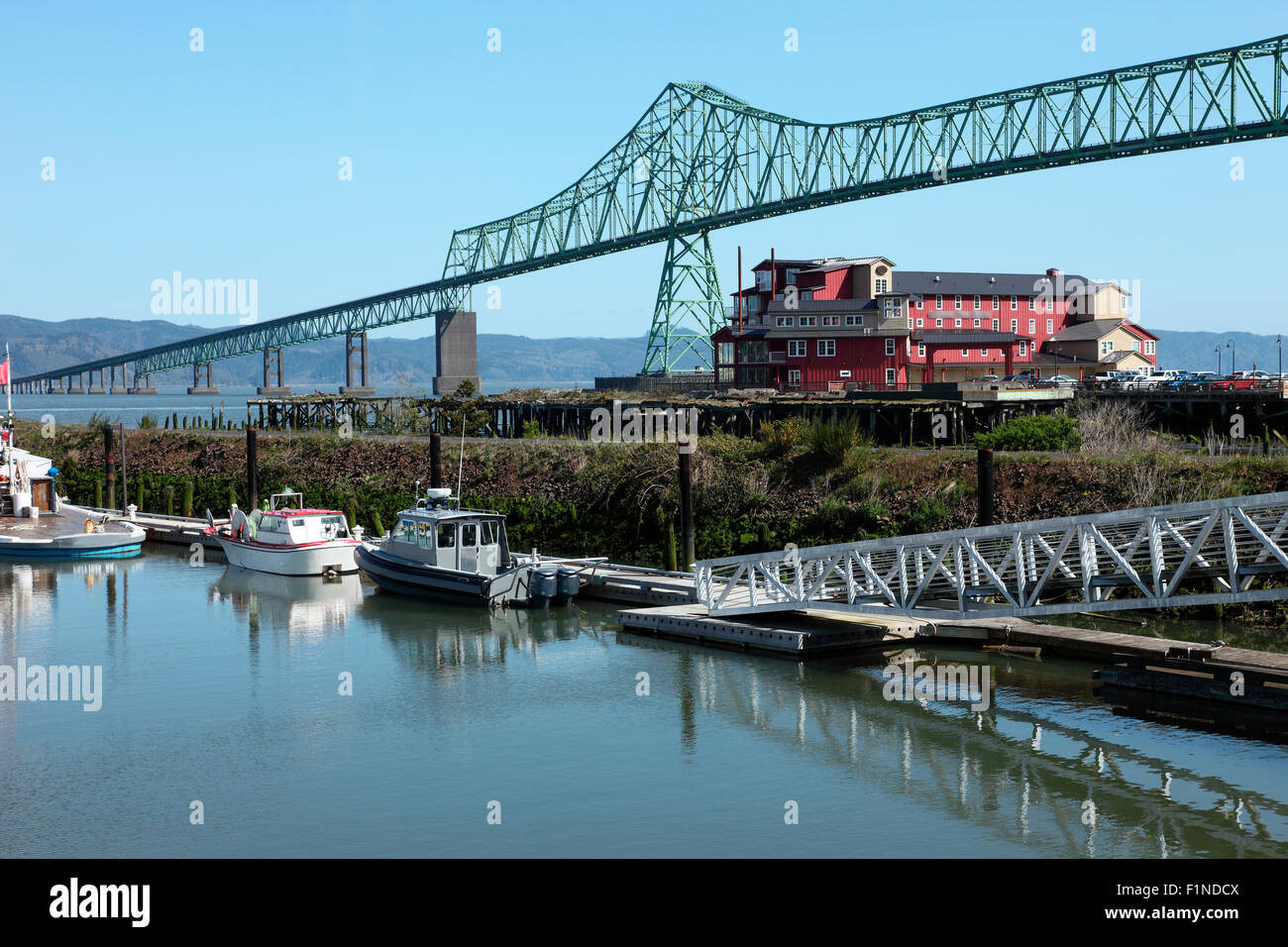 The Astoria bridge the old cannery hotel and marina Stock Photo - Alamy