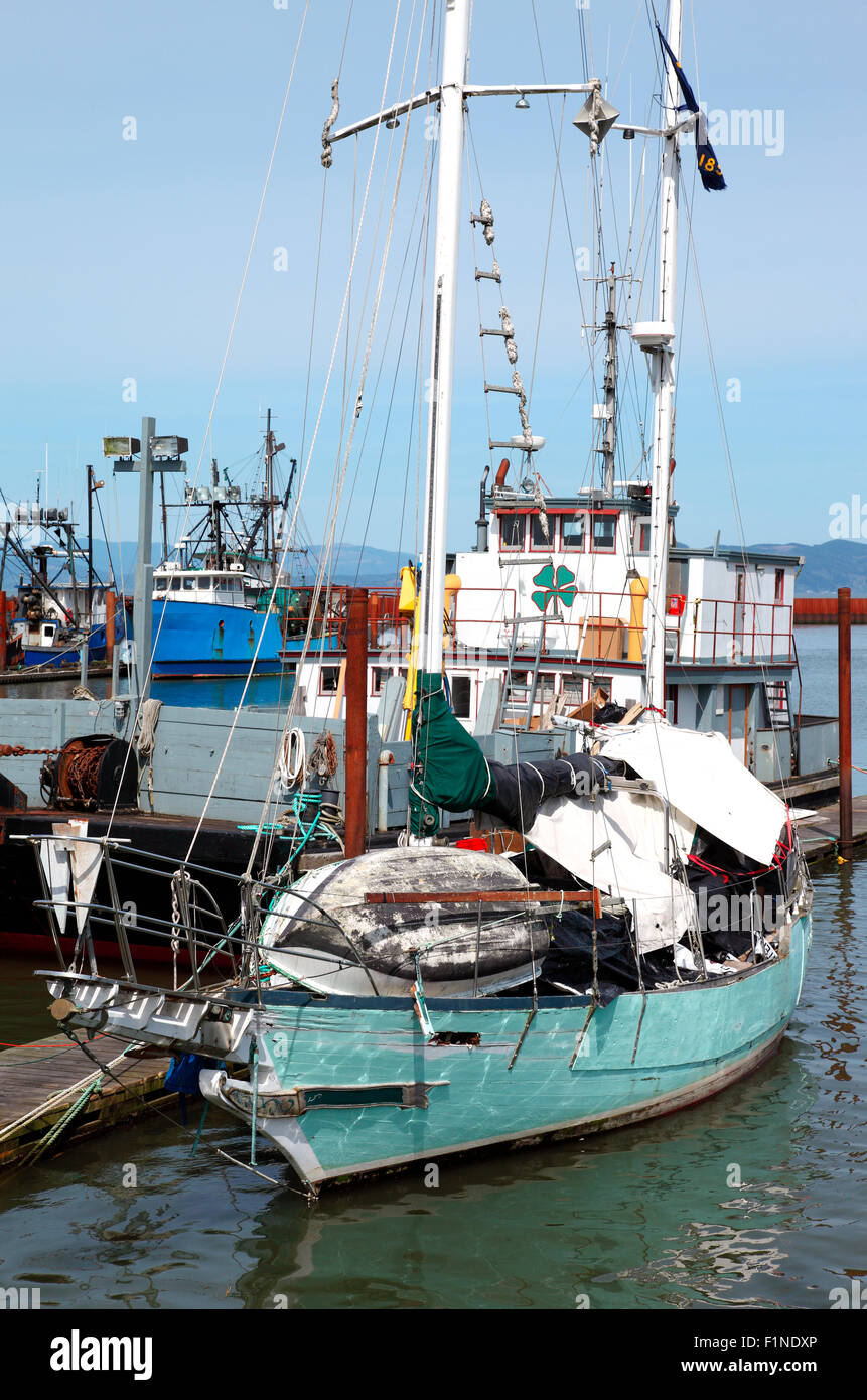 Old boat loaded at a pier in Astoria Oregon Stock Photo - Alamy