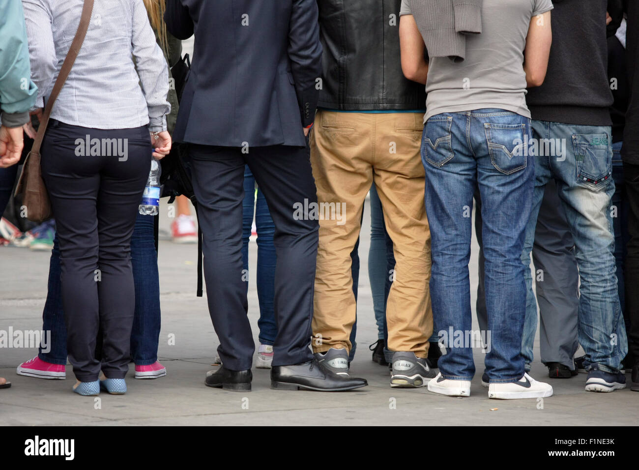 Back view of a group of people standing in Covent Garden, London ...