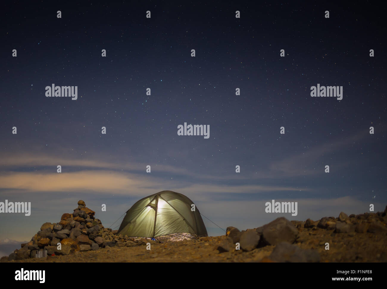 Tourist stand near tent Stock Photo - Alamy