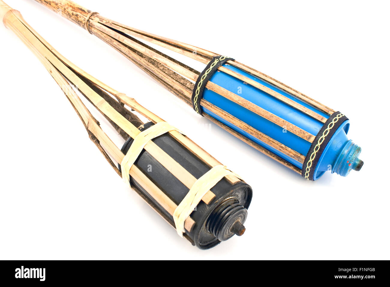 Bamboo fire torch isolated on white Stock Photo - Alamy