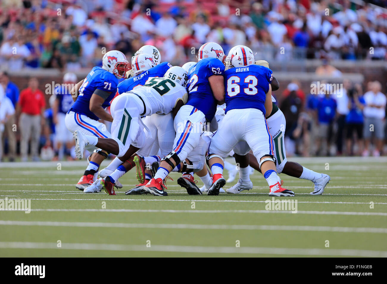 Gang tackle hi-res stock photography and images - Alamy