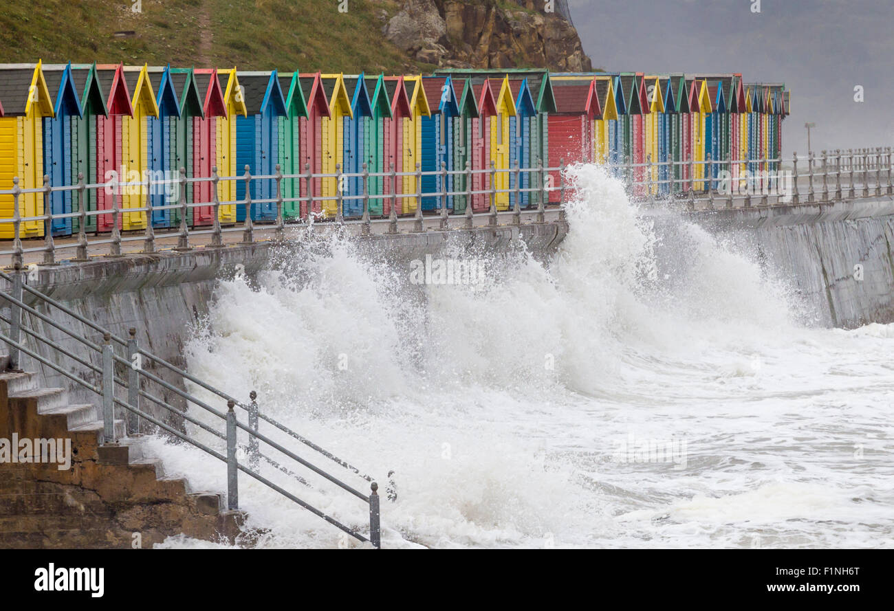 Stormy weather as waves break over the sea wall Whitby, North Yorkshire ...