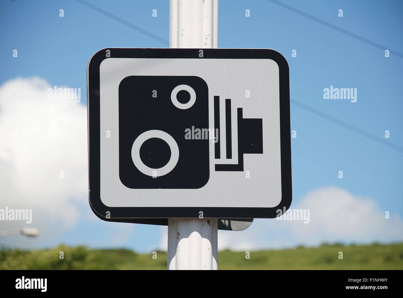 A speed camera warning sign on a road at Folkestone in Kent, England ...