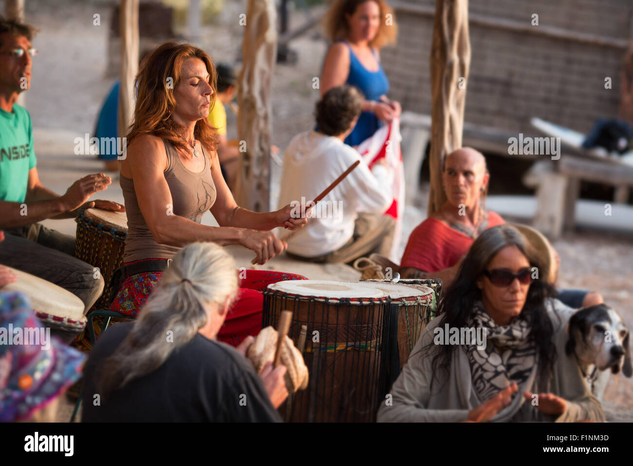 People drumming at sunset at Benirras Beach, Ibiza Stock Photo - Alamy