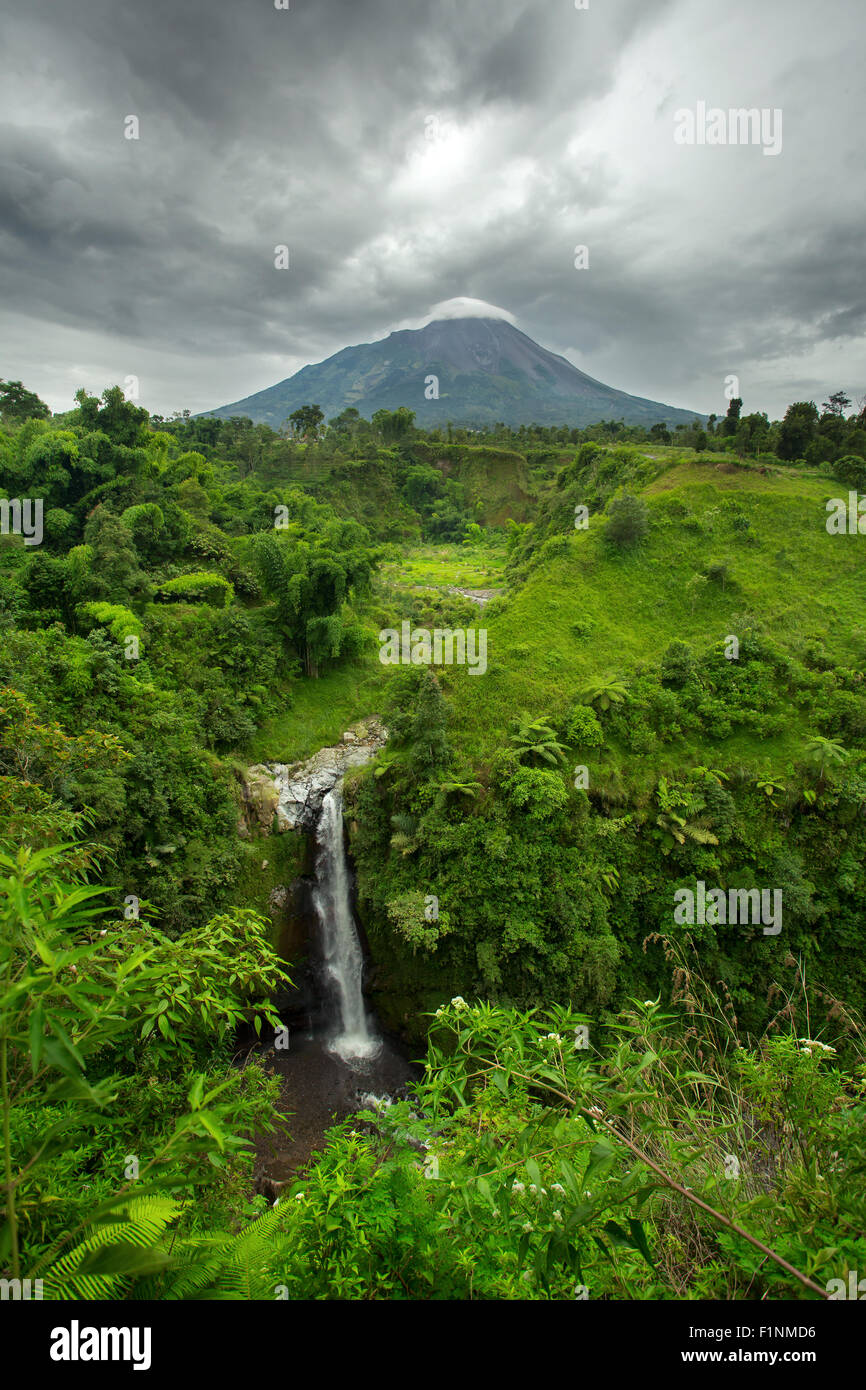 Kedung Kayang Waterfall and Mountain Merapi volcano. Java, Indonesia ...