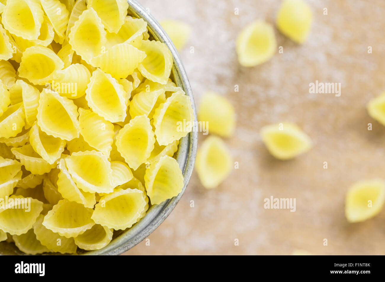 Pasta conchigliette in a steel bucket top view Stock Photo - Alamy