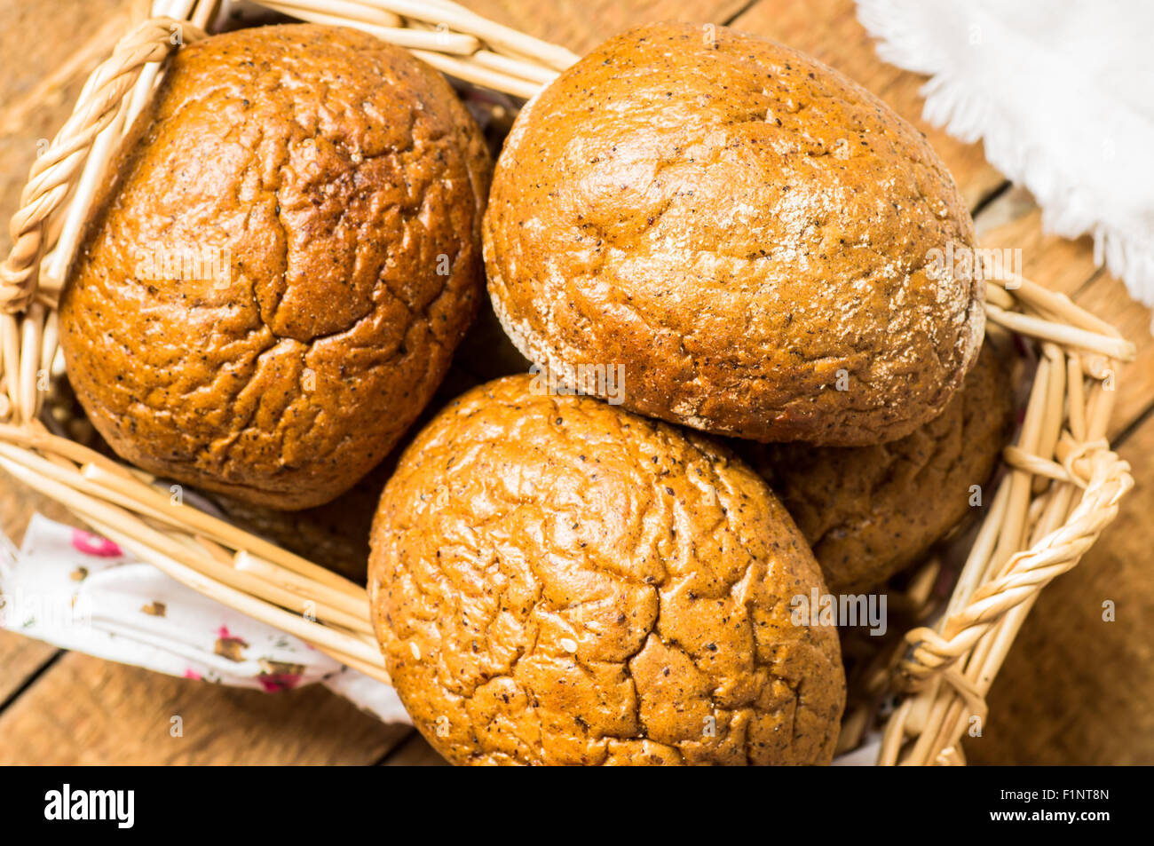 Buns in a basket on the table top view Stock Photo - Alamy