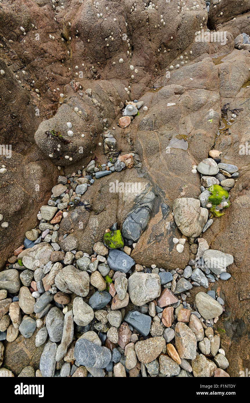 small granite rocks wearing granite shoreline rock Stock Photo - Alamy