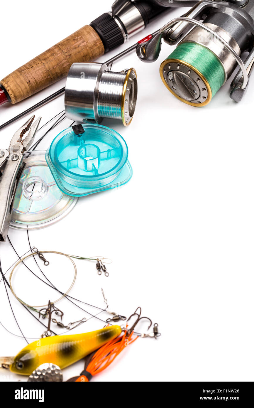 different fishing tackles - rod, reel, line and lures on white ...