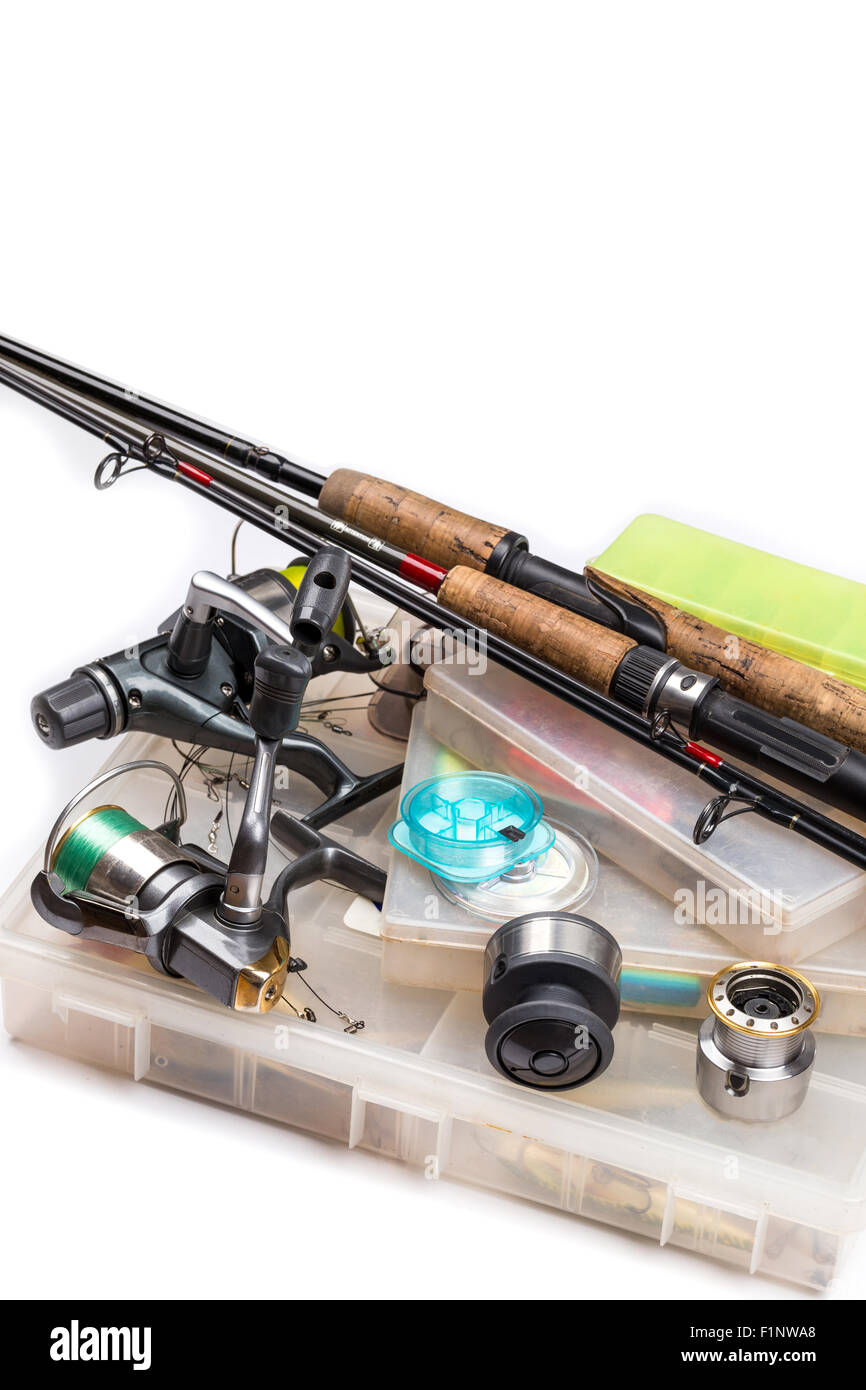 different fishing tackles - rod, reel, line and lures in box on white ...