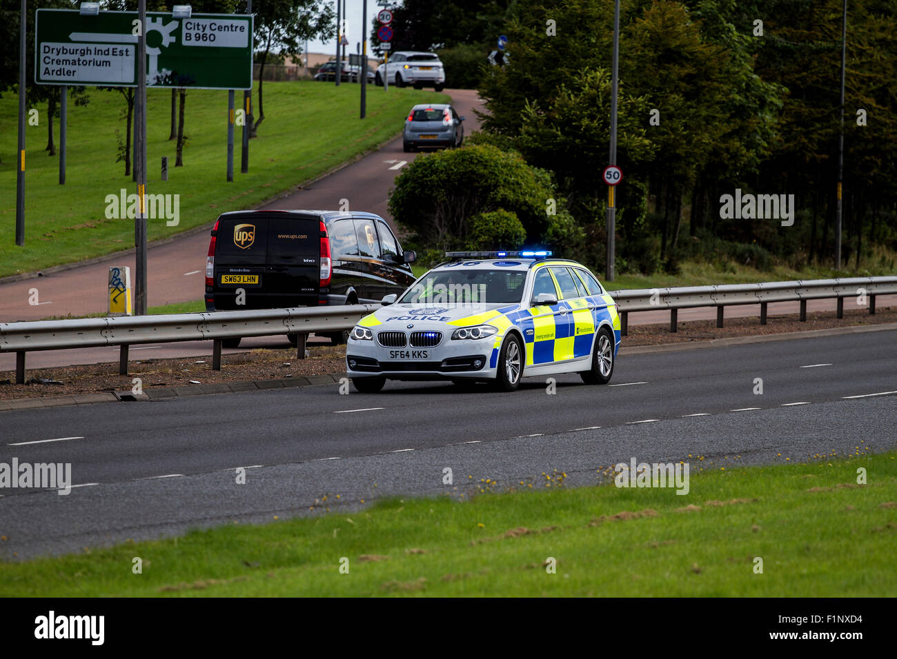 A Police Scotland police car escorting a Forth Ports Crane on the ...