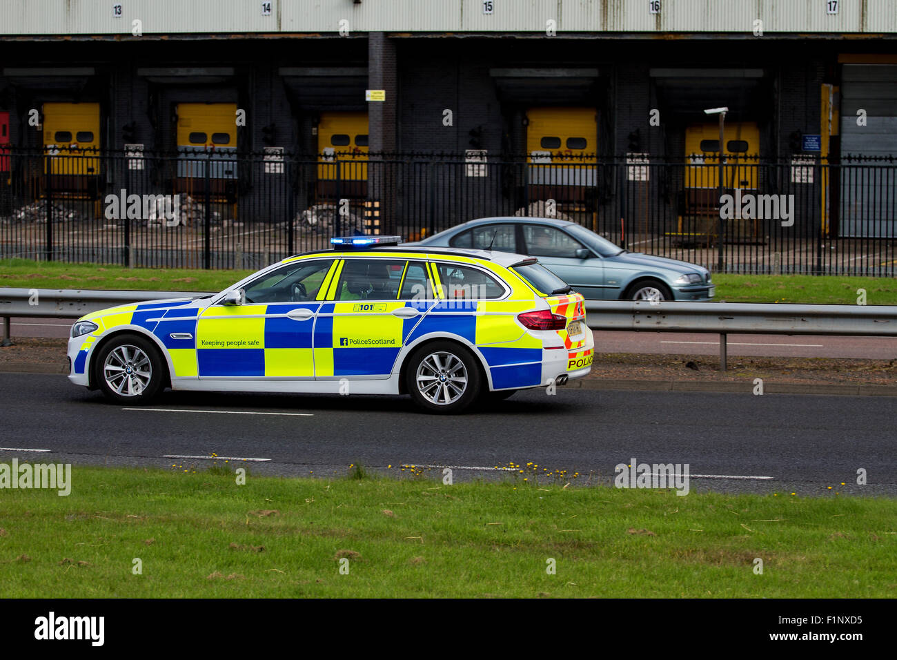 A Police Scotland police car escorting a Forth Ports Crane on the ...