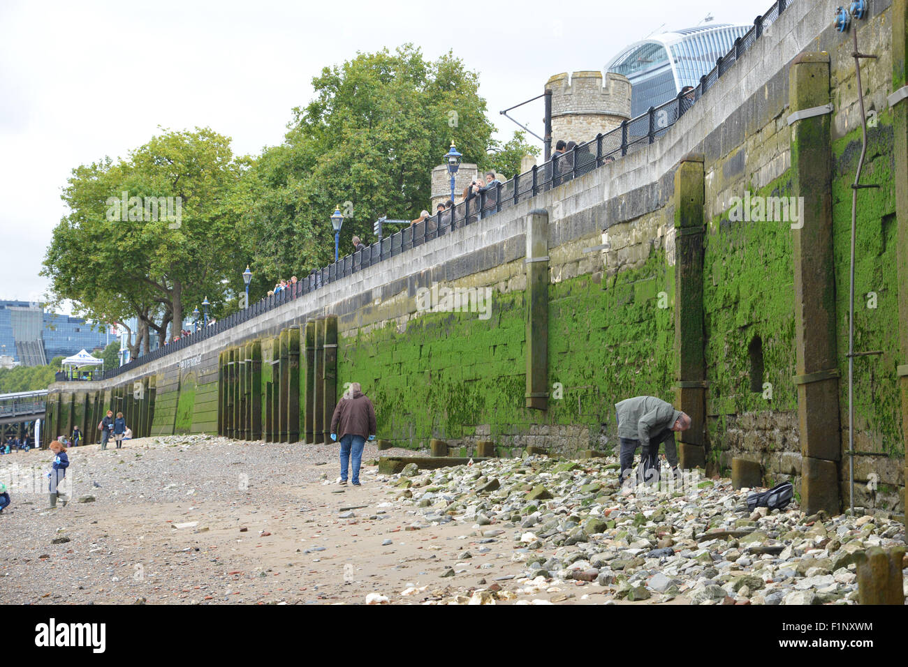 Members of the public explore the Tower Beach next to the Tower of ...