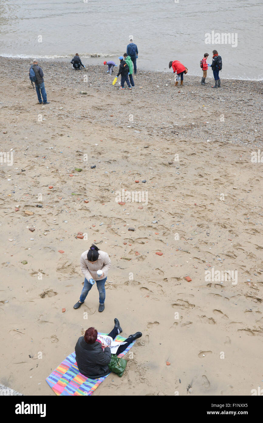 Members of the public explore the Tower Beach next to the Tower of ...