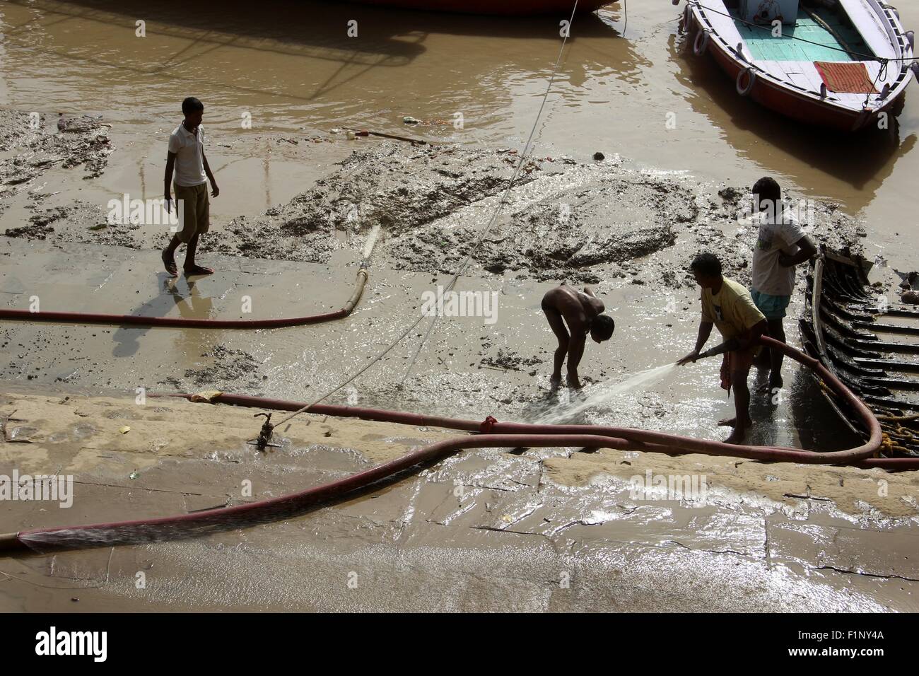 Sulabh worker clean the dirt of Assi ghat on bank of holy river Ganga ...