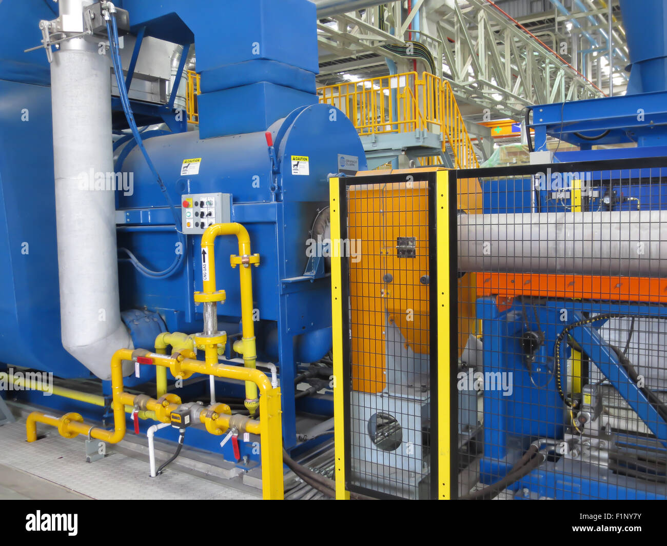 Heater machine aluminum rods Stock Photo - Alamy