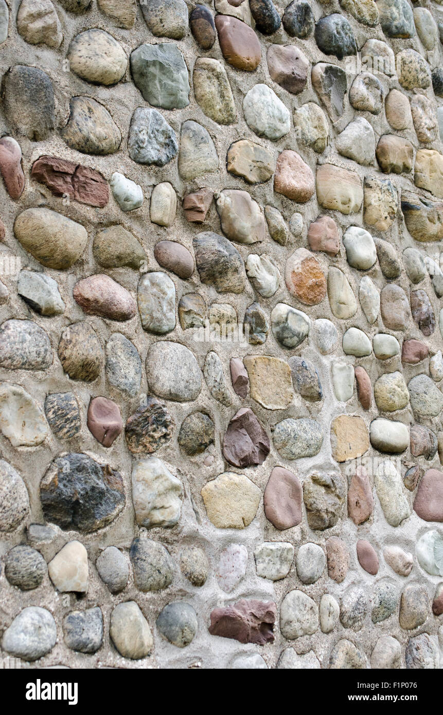 Wall covered with cobblestone and mortar Stock Photo - Alamy